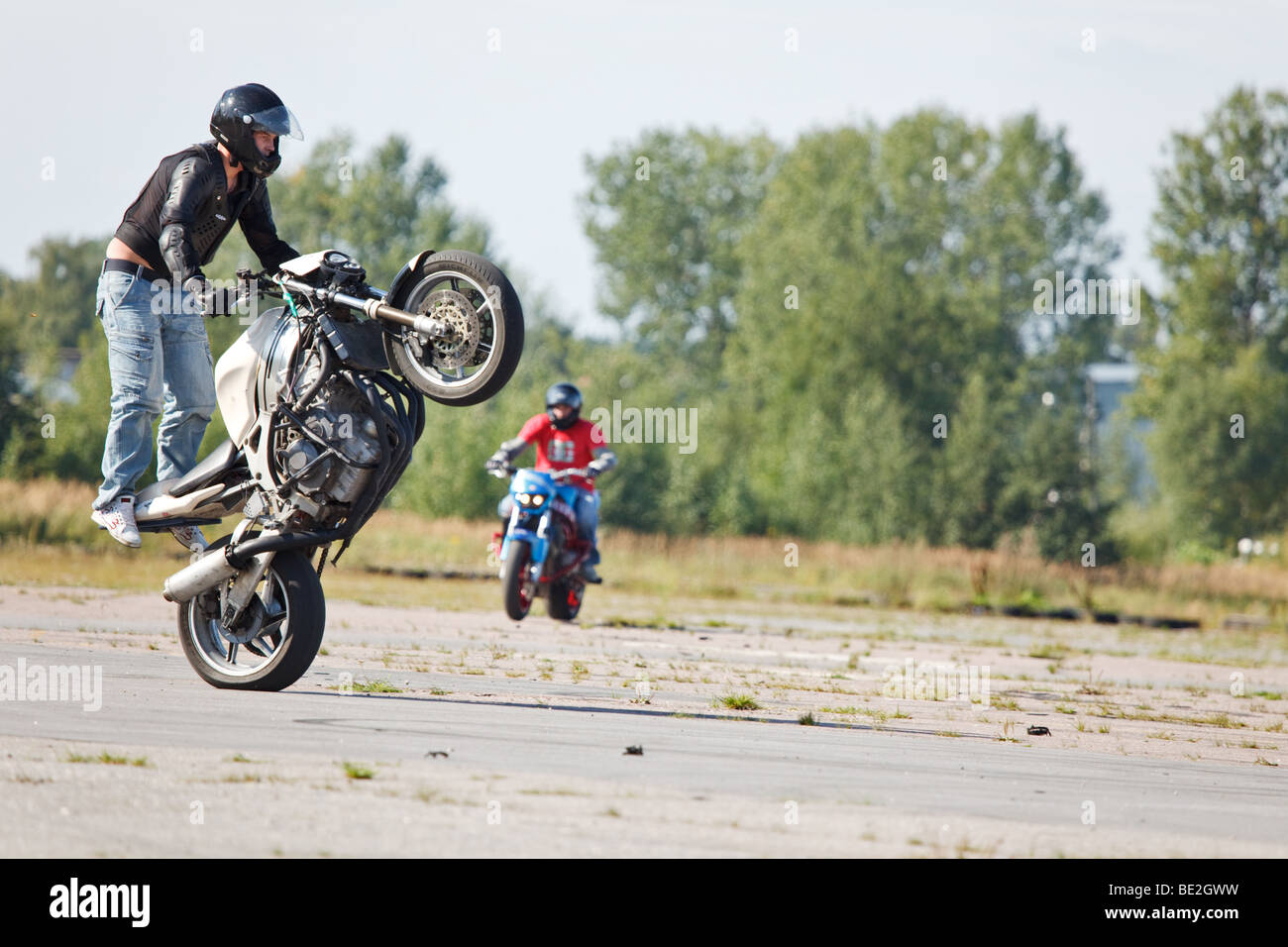 Stunt rider making wheelie Stock Photo - Alamy