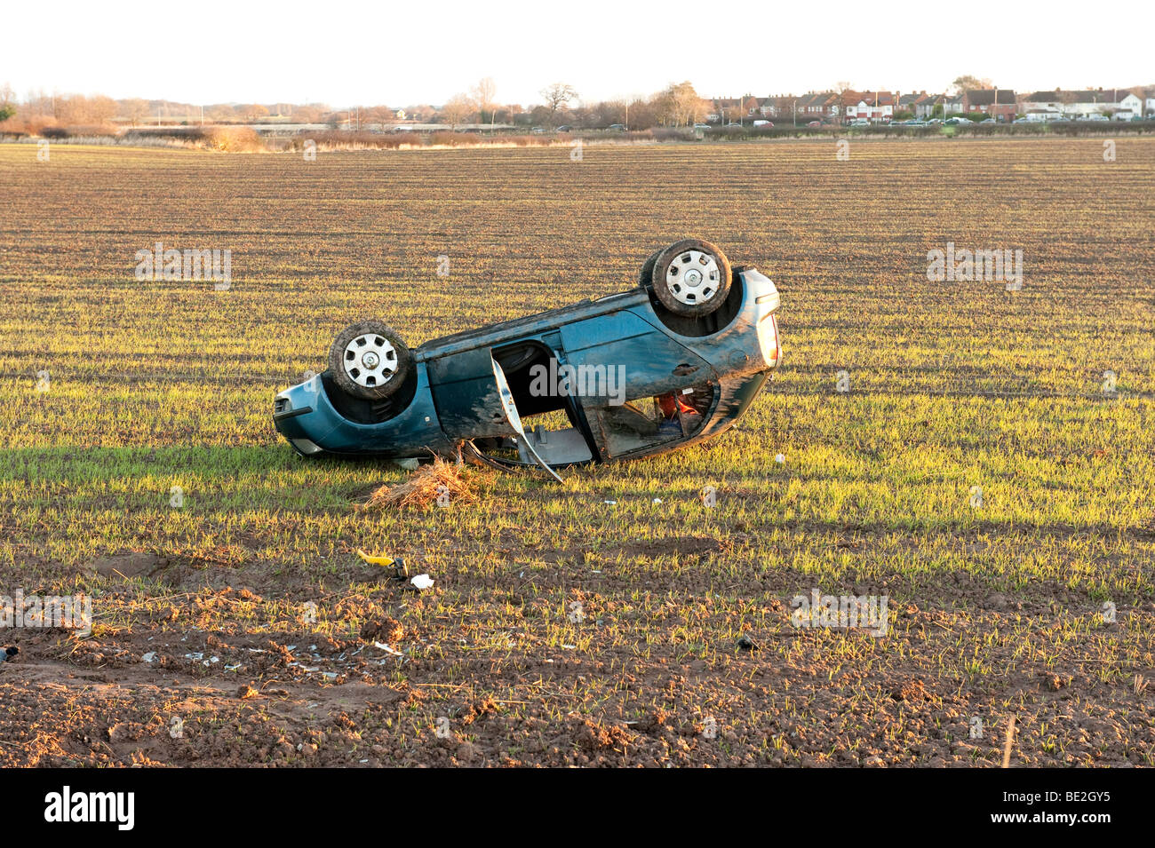 Car crashed and overturned in field Stock Photo - Alamy