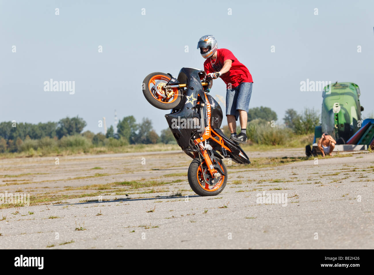 Stunt rider making wheelie Stock Photo - Alamy