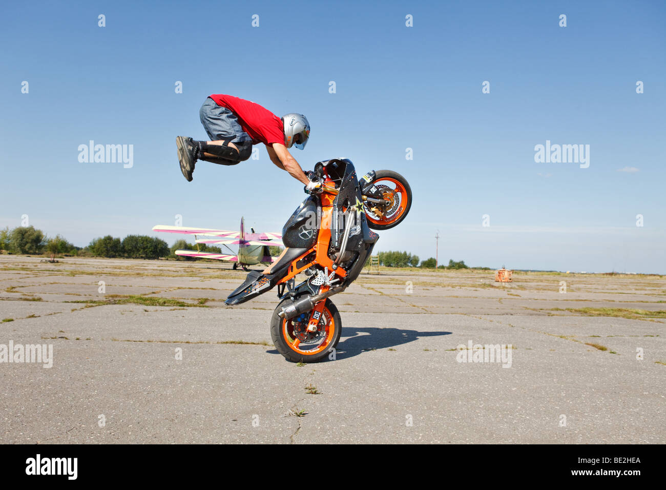 Stunt rider making wheelie Stock Photo - Alamy