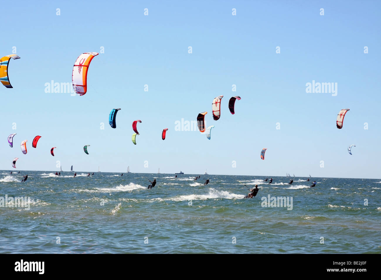 Kiteboarding competition, many kites in the sky Stock Photo - Alamy