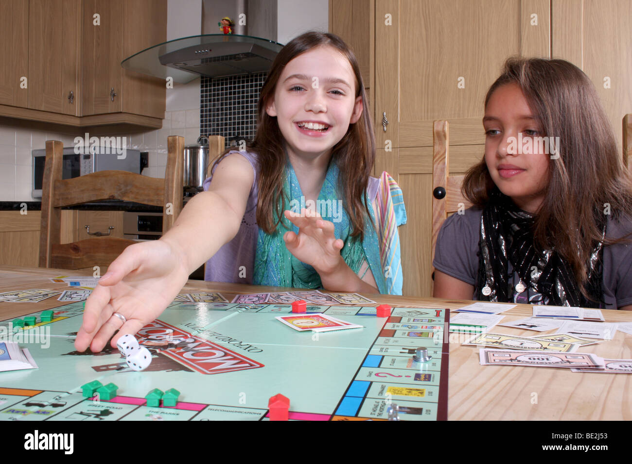 Kids playing monopoly hi-res stock photography and images - Alamy
