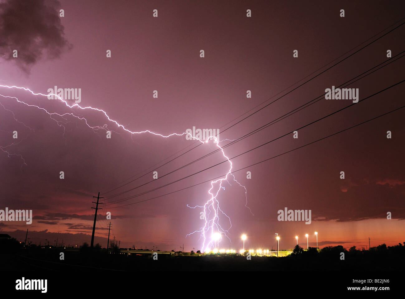 Lightning strikes during a monsoon storm near a sports field in Tucson ...