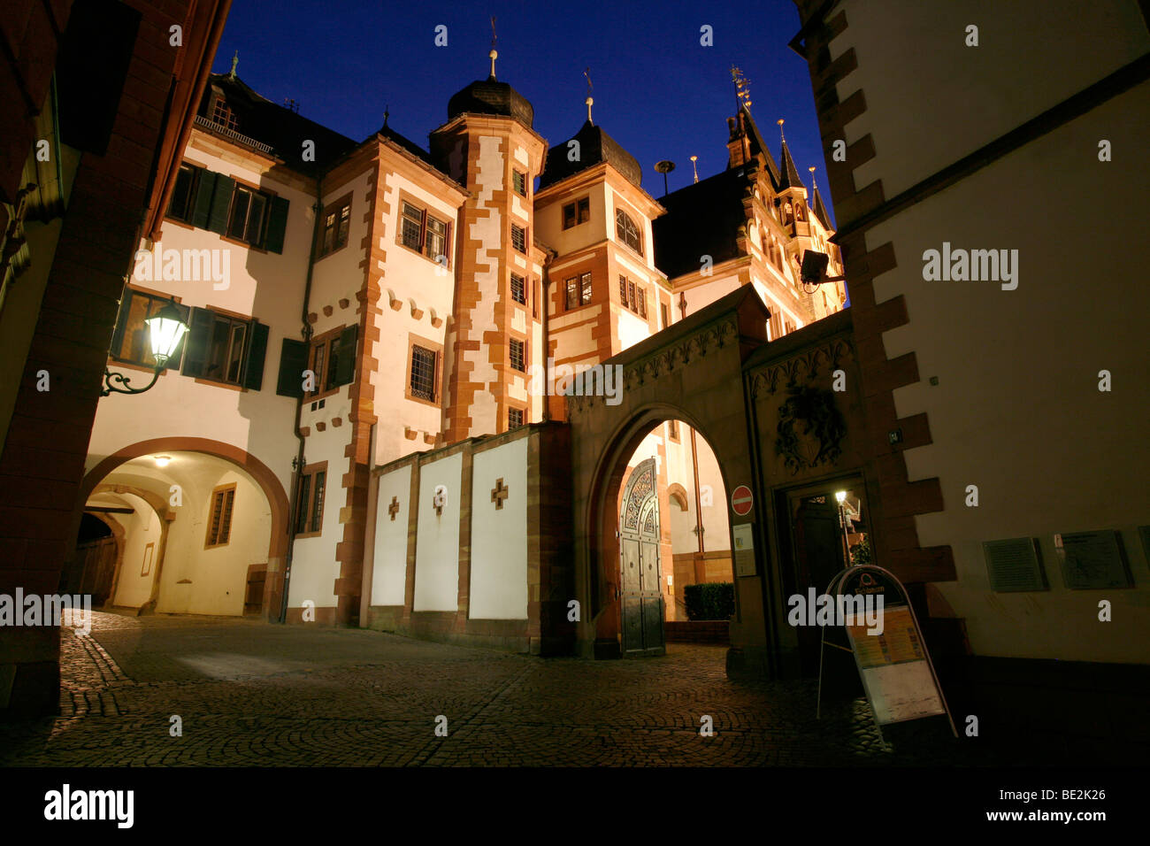 Weinheimer Castle with the entrance to the Market Square at dusk ...