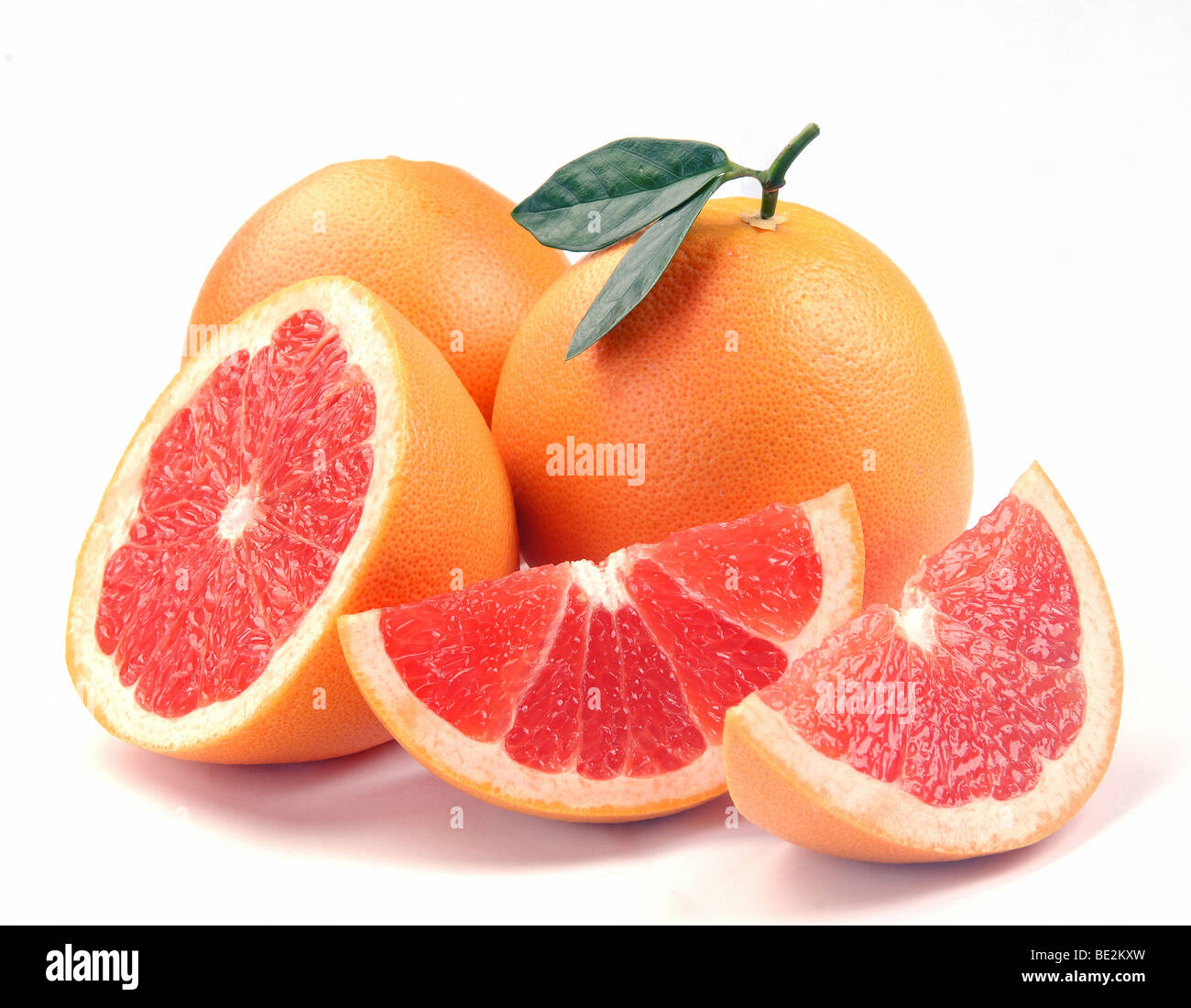 Grapefruit with segments on a white background Stock Photo - Alamy