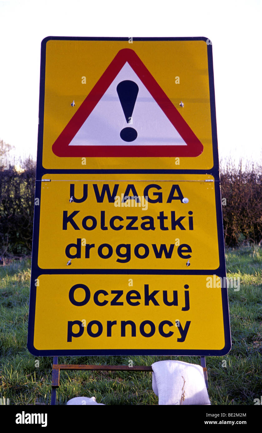 Yellow roadworks sign written in Polish in UK Stock Photo - Alamy