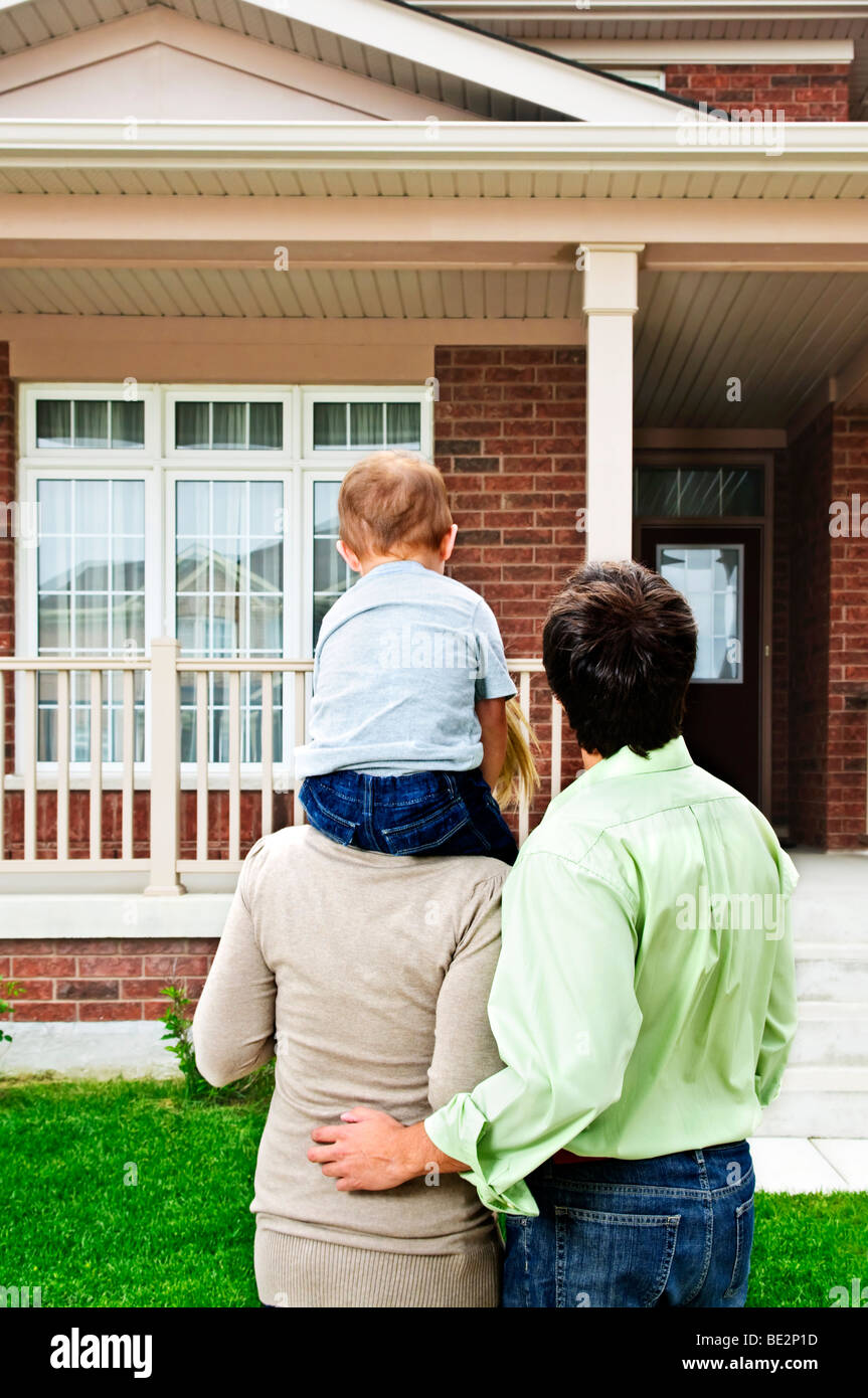 Young happy family shopping for new home Stock Photo - Alamy