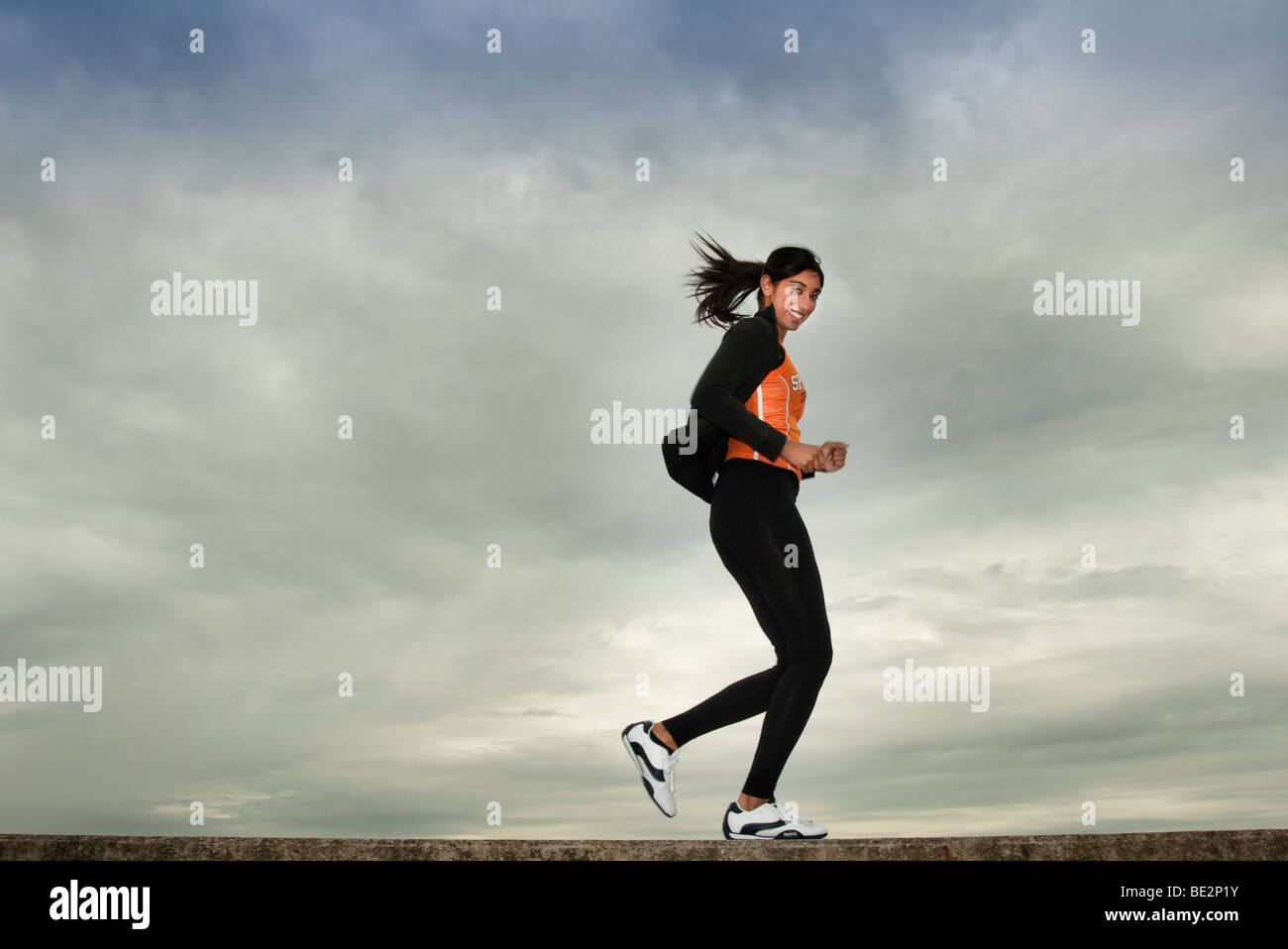 ethnic woman running Stock Photo - Alamy