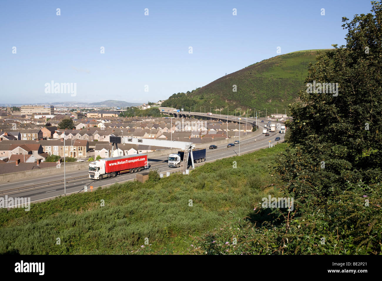 M4 motorway road at Port Talbot, junction 40 with Nolan Transport lorry ...