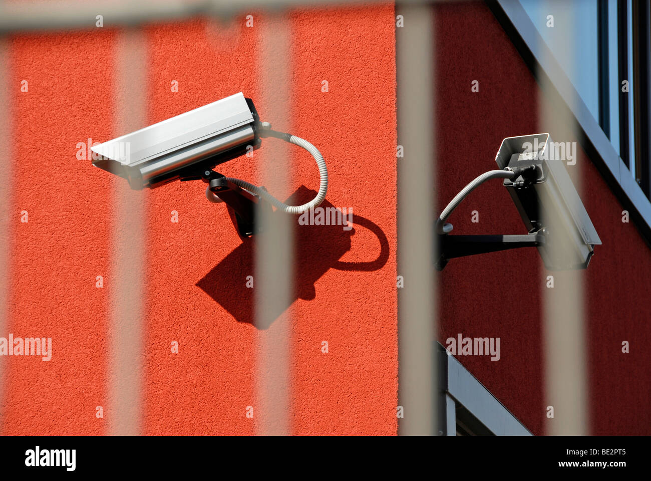 Surveillance camera behind a fence, symbol for surveillance state Stock ...