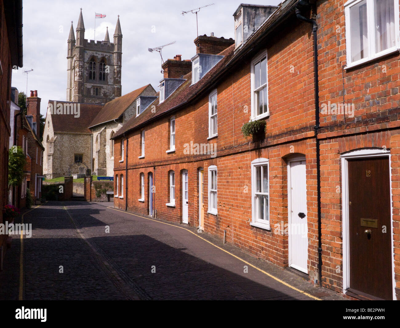 Row of Victorian terraced houses / cottages in front of St Andrew's ...