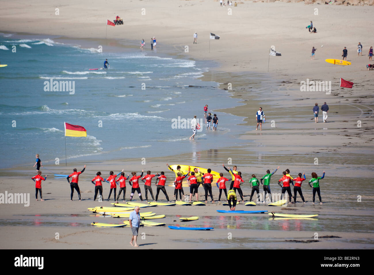 Surf school exercising, beach, Sennen Cove, Cornwall, England Stock ...
