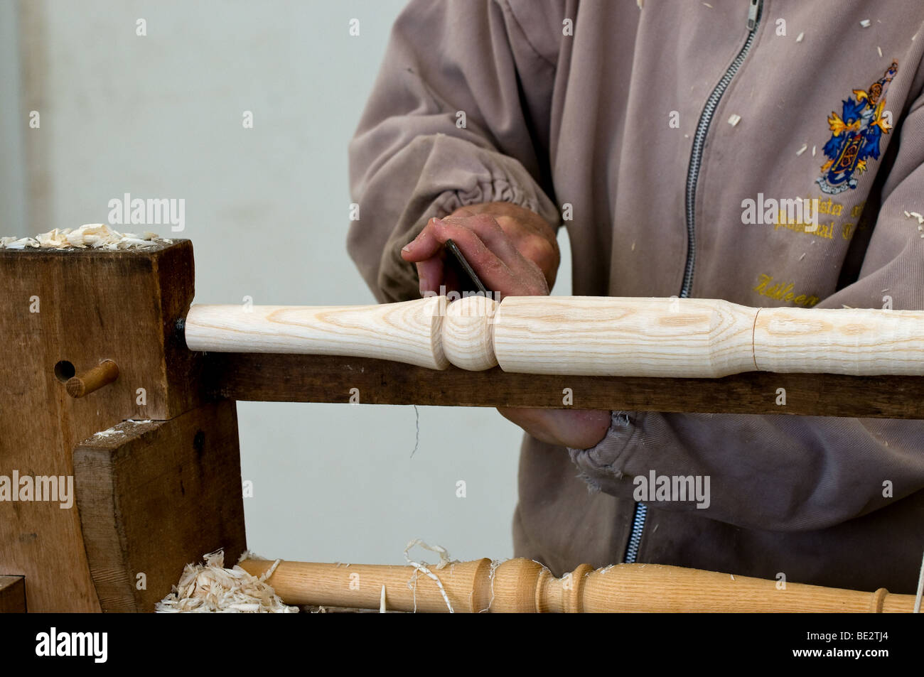 A traditional bodger turning a chair leg on a lathe at the Essex County ...