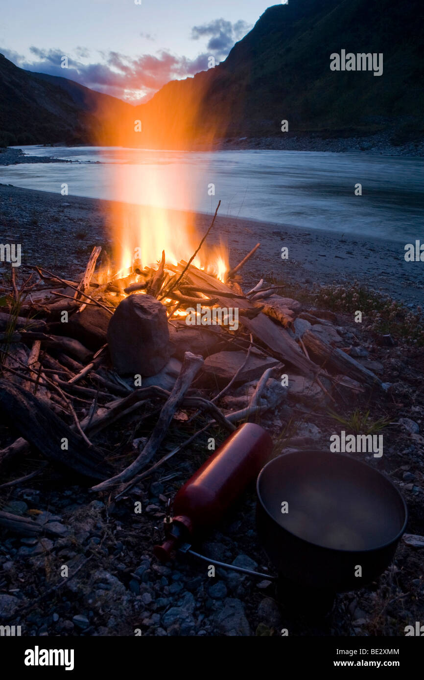 Campfire at dusk on the Shotover River in Skippers Canyon, Queenstown ...