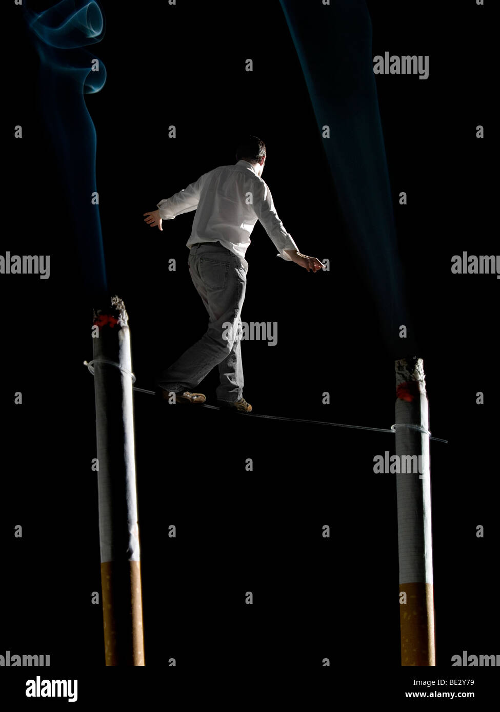 Walking a tightrope hi-res stock photography and images - Alamy