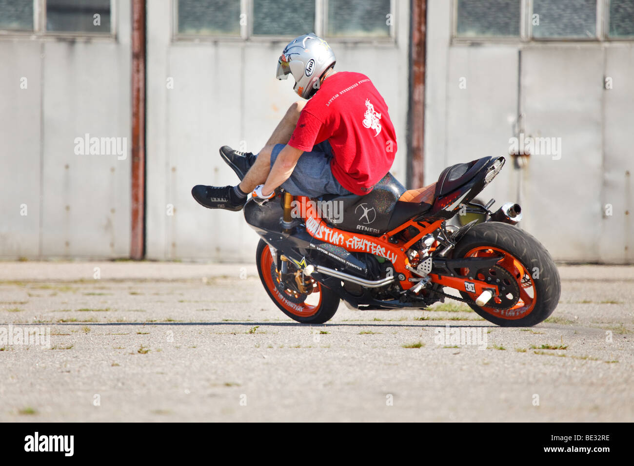 Man sitting wheel bike riding hi-res stock photography and images - Alamy