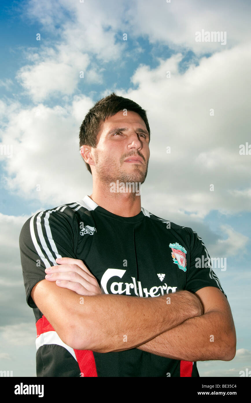 footballer standing with arms crossed Stock Photo - Alamy