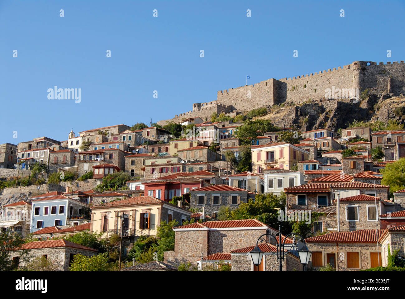 View of the houses in the old town with fortress, Mithymna, Molyvos ...