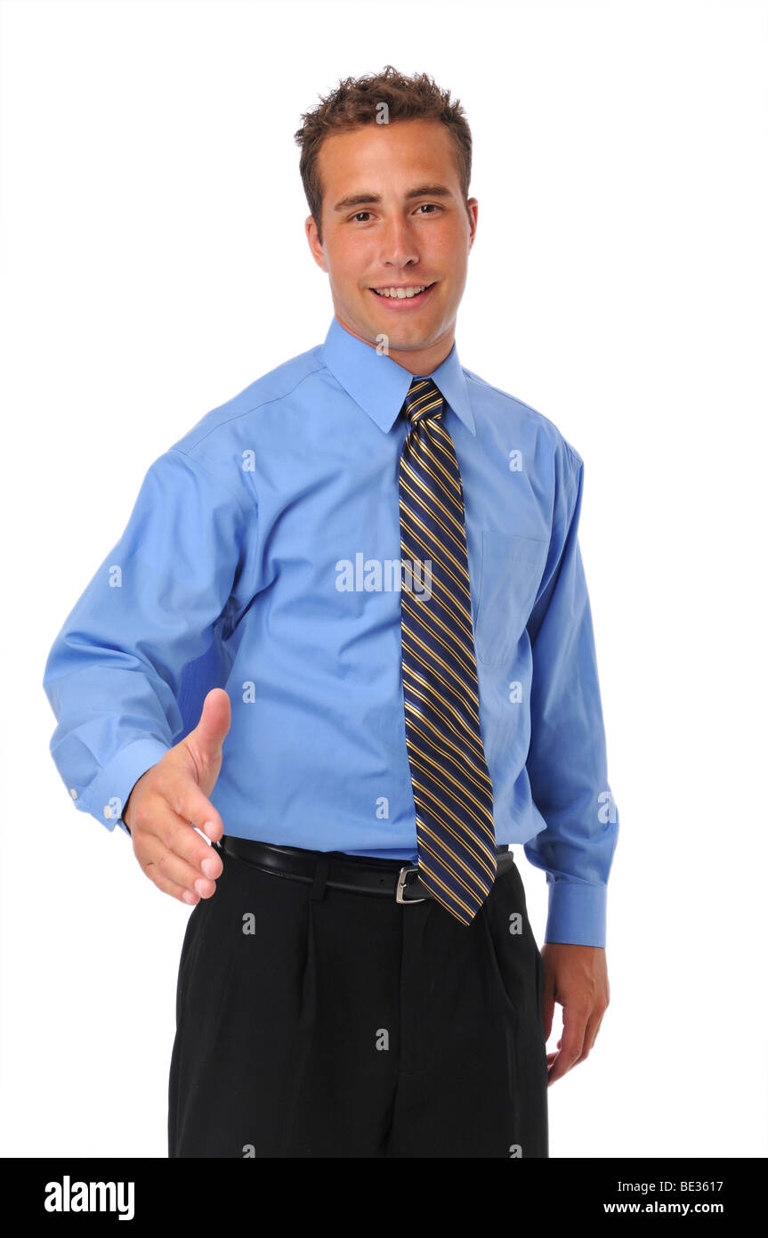 Businessman welcoming with extended hand against a white background ...