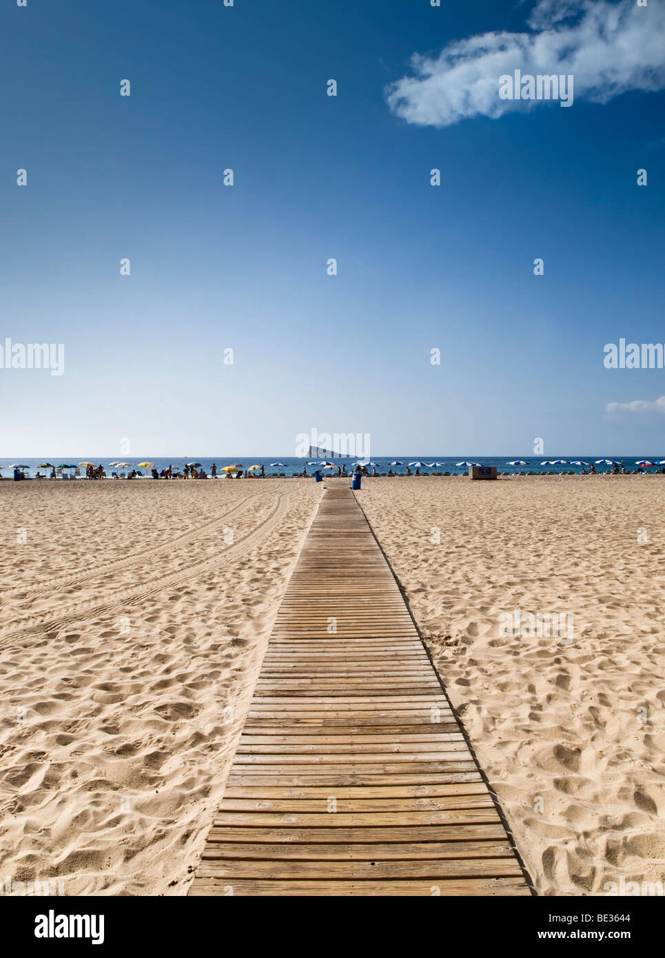 Vertical landscape of a Mediterranean beach, with a wood plank walkway ...