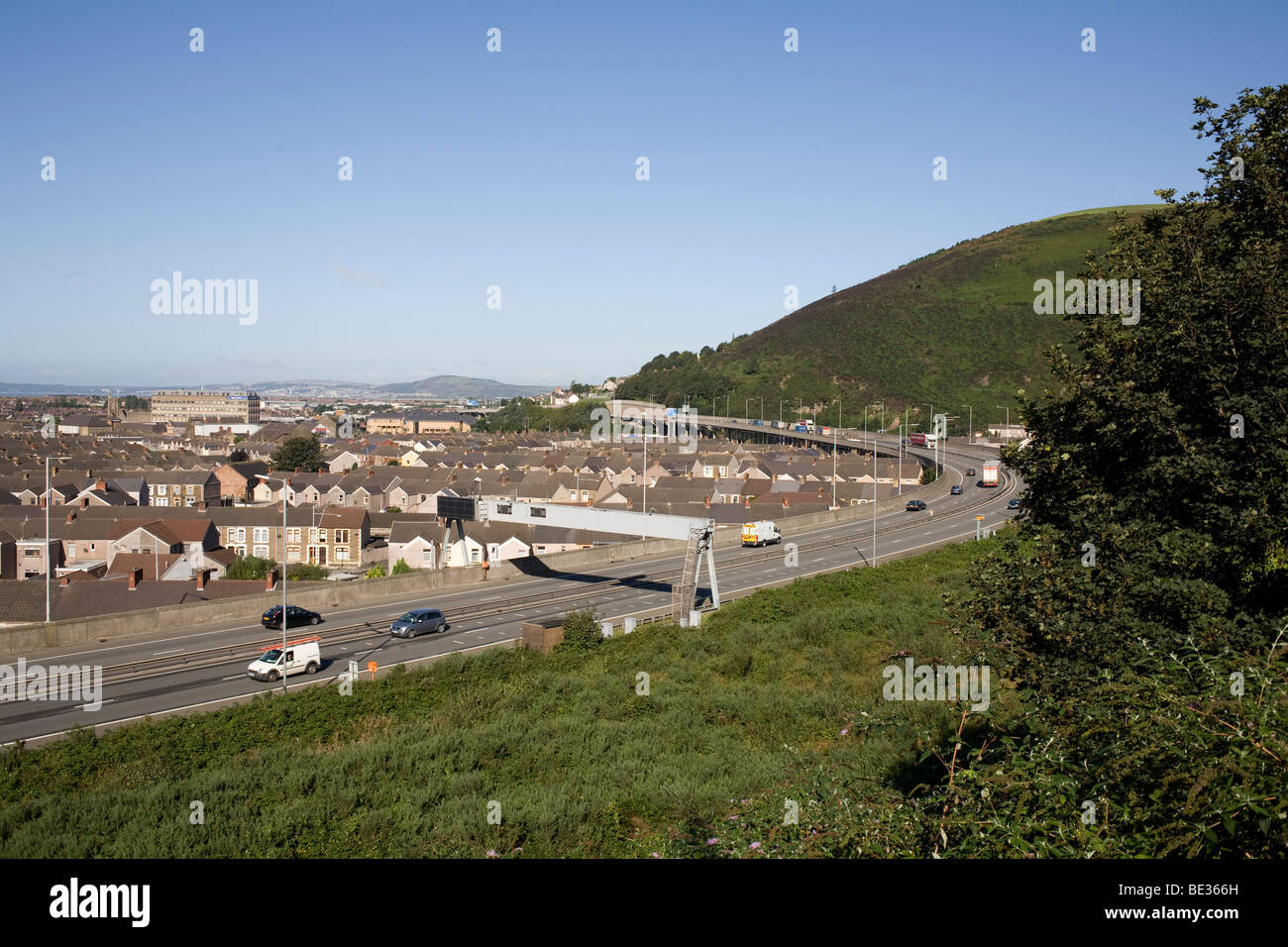 M4 motorway, an elevated road at junction 40 Port Talbot with 50 mph ...