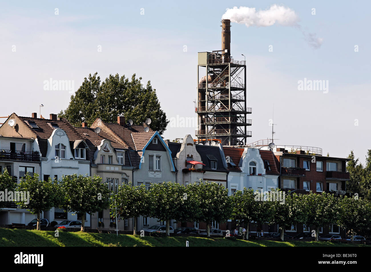 Beautiful old villas along the Rhine front, in the back the smoking ...