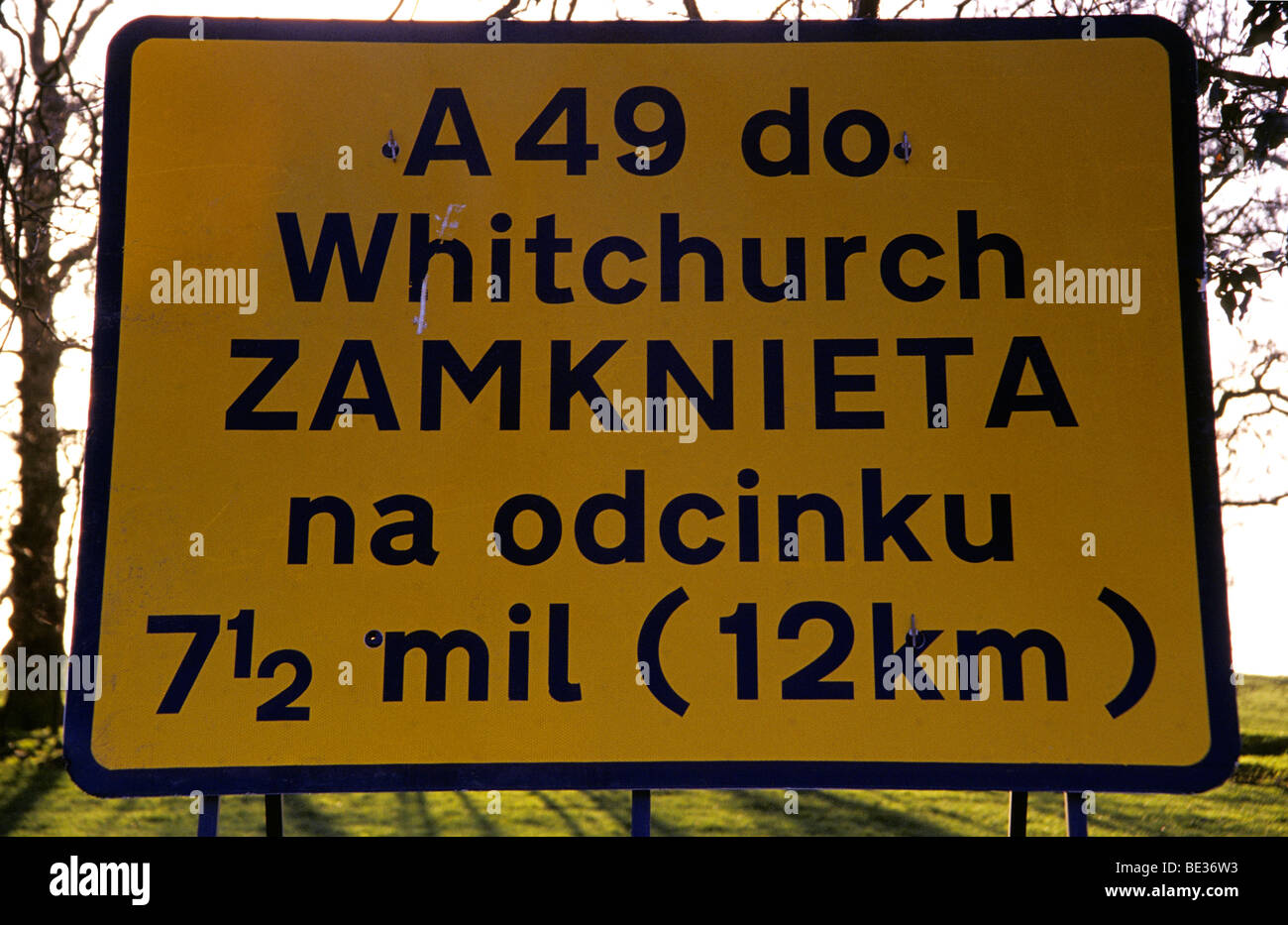 Yellow roadworks sign written in Polish in UK Stock Photo - Alamy