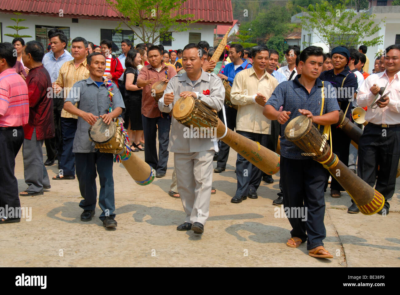Ethnology, Phunoi men and musicians playing music on drums, Pi Mai, Lao ...