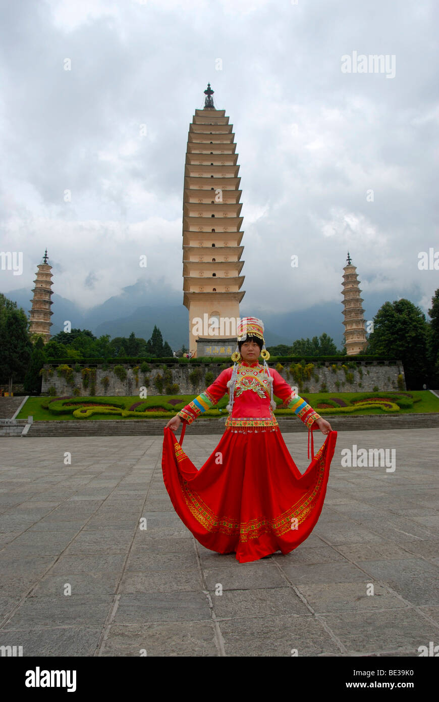 Chinese woman of the Bai ethnic group in a red dress, Three Pagodas ...
