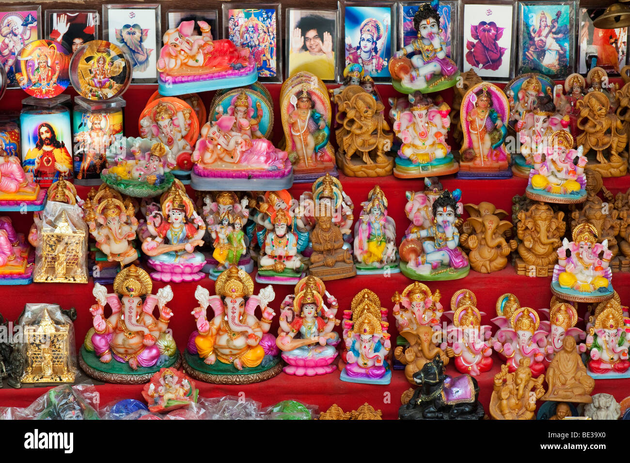 Indian religious statues and pictures on a market stall. India Stock ...