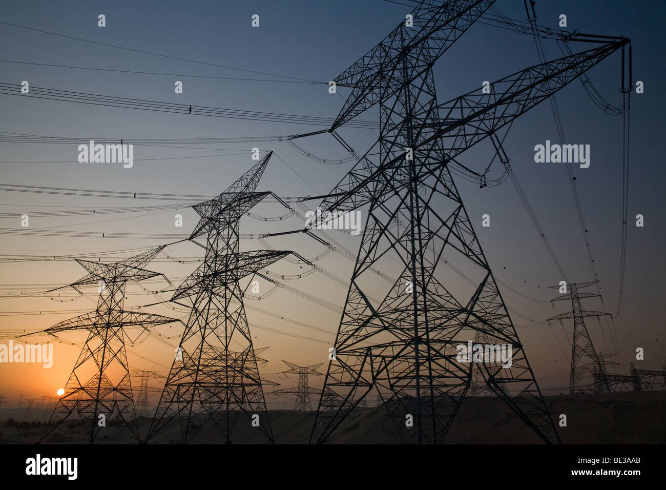 Transmission lines towers tower pylon power line Stock Photo - Alamy