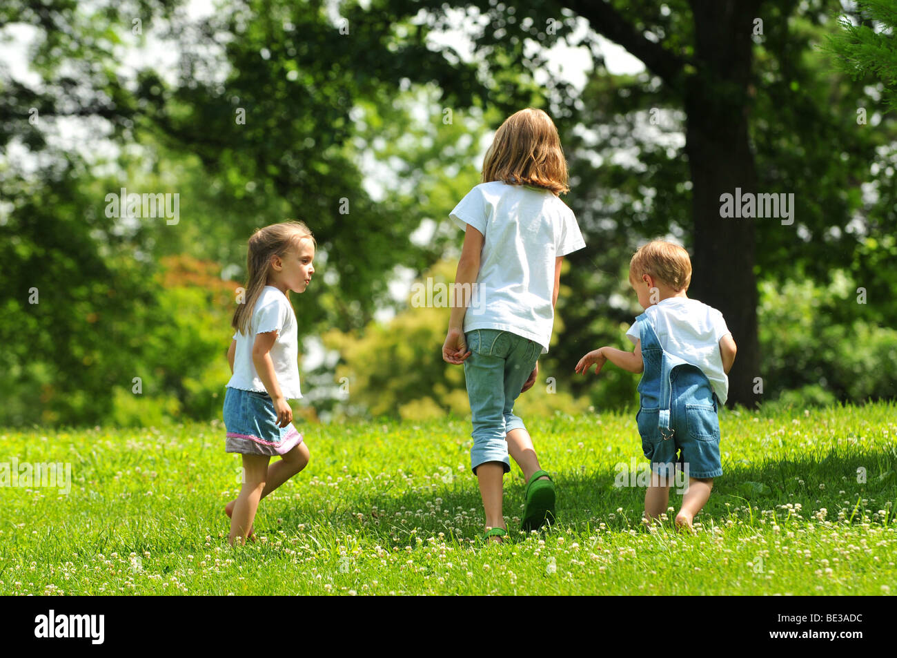 Children playing outdoors in the park Stock Photo - Alamy