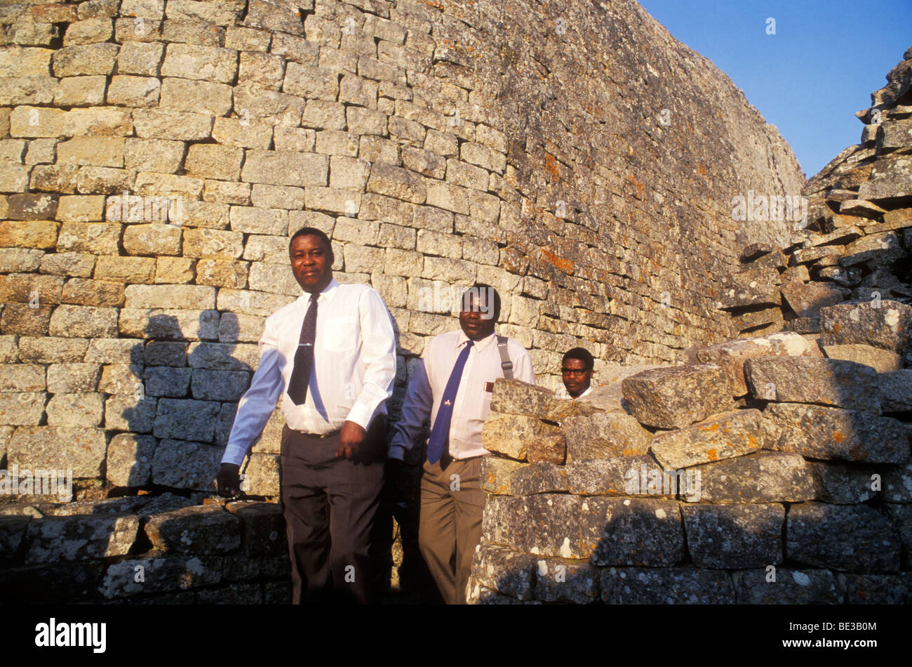 A group of teachers tour the Great Zimbabwe ruins, near Masvingo ...