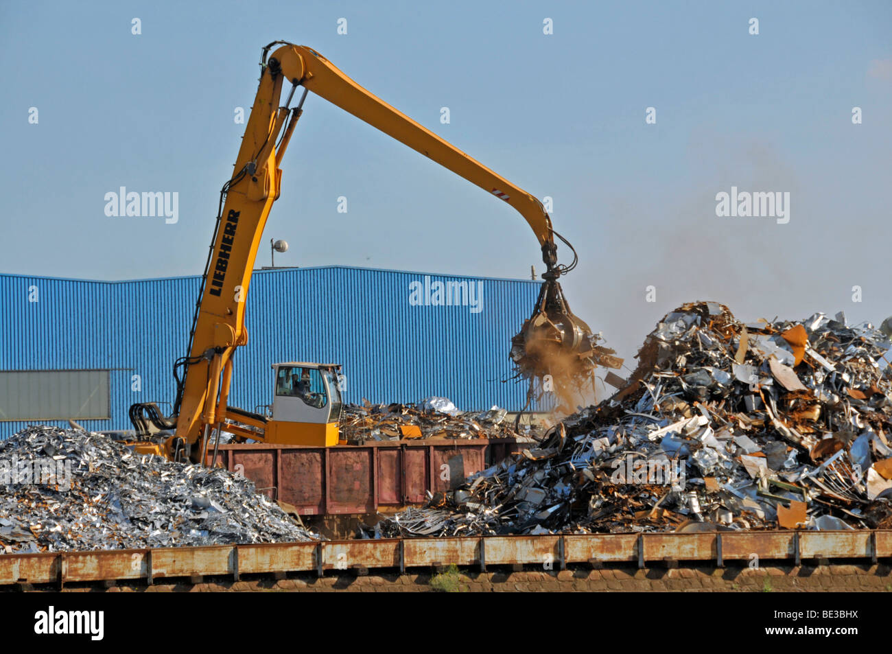 Bulk-handling crane on a scrap yard, scrap island, DuisPort inland port ...