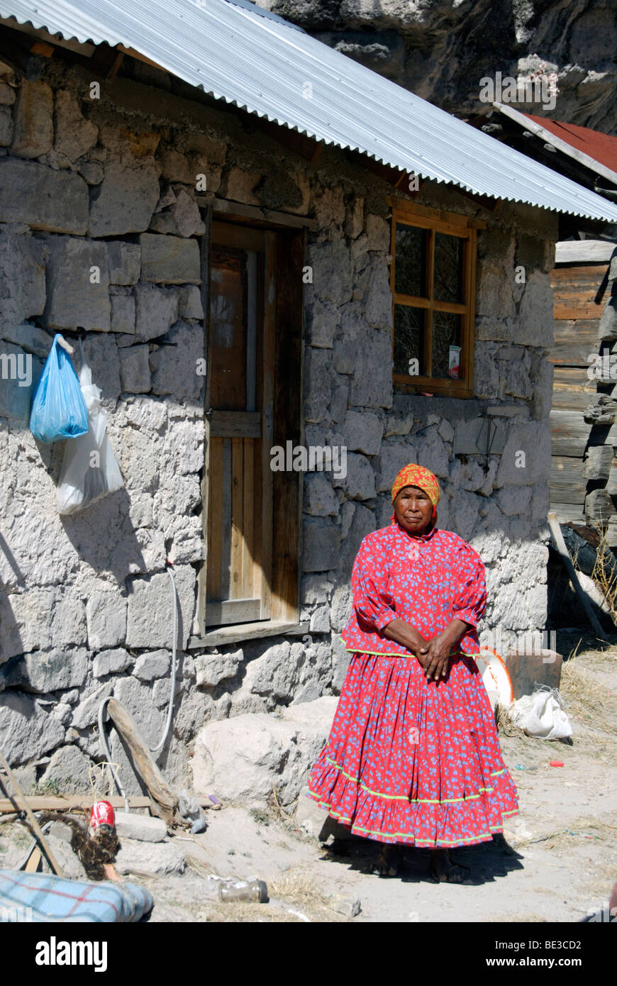 Tarahumara Indian woman in traditional dress in front of her house near ...