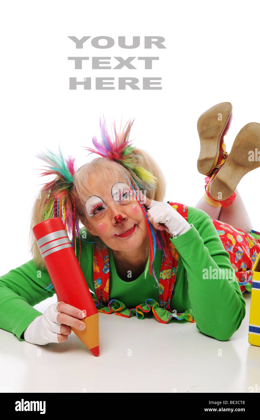 Clown with color pencil lying down and against white Stock Photo - Alamy