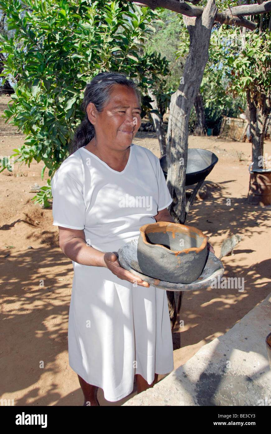Mayo Indian woman making clay pot in her village near El Fuerte ...