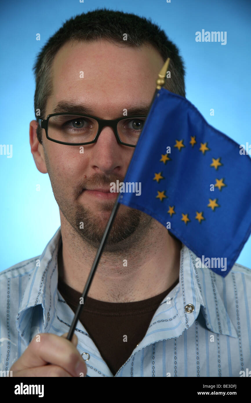 Man holding European Union flag Stock Photo - Alamy