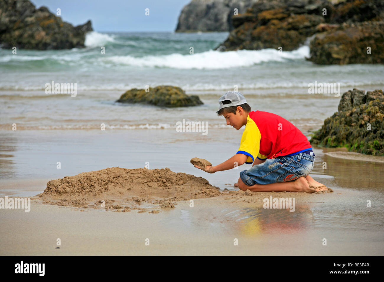 young boy building a sandcastle at Durness Beach, Scotland, Great ...