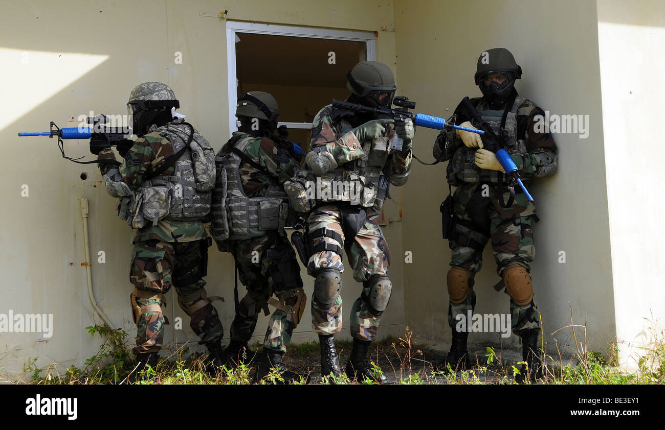 Security Forces members perform a quick check before entering a house ...