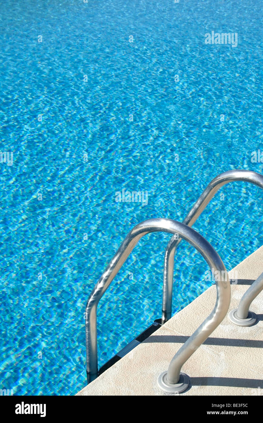 Hotel swimming pool with sunny reflections, great for summer and ...