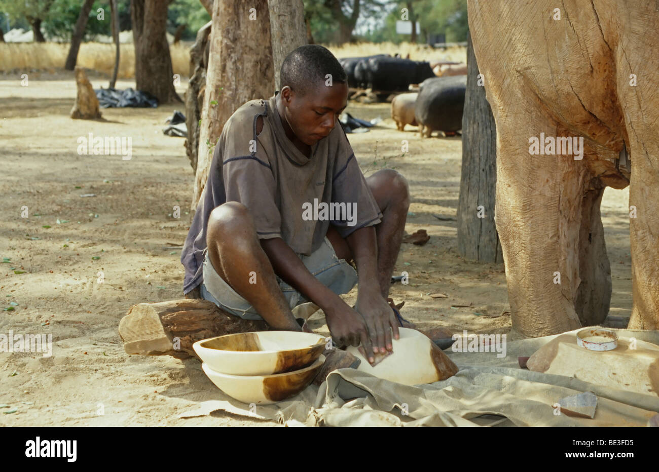 Wood carver at work, Namibia, Africa Stock Photo - Alamy