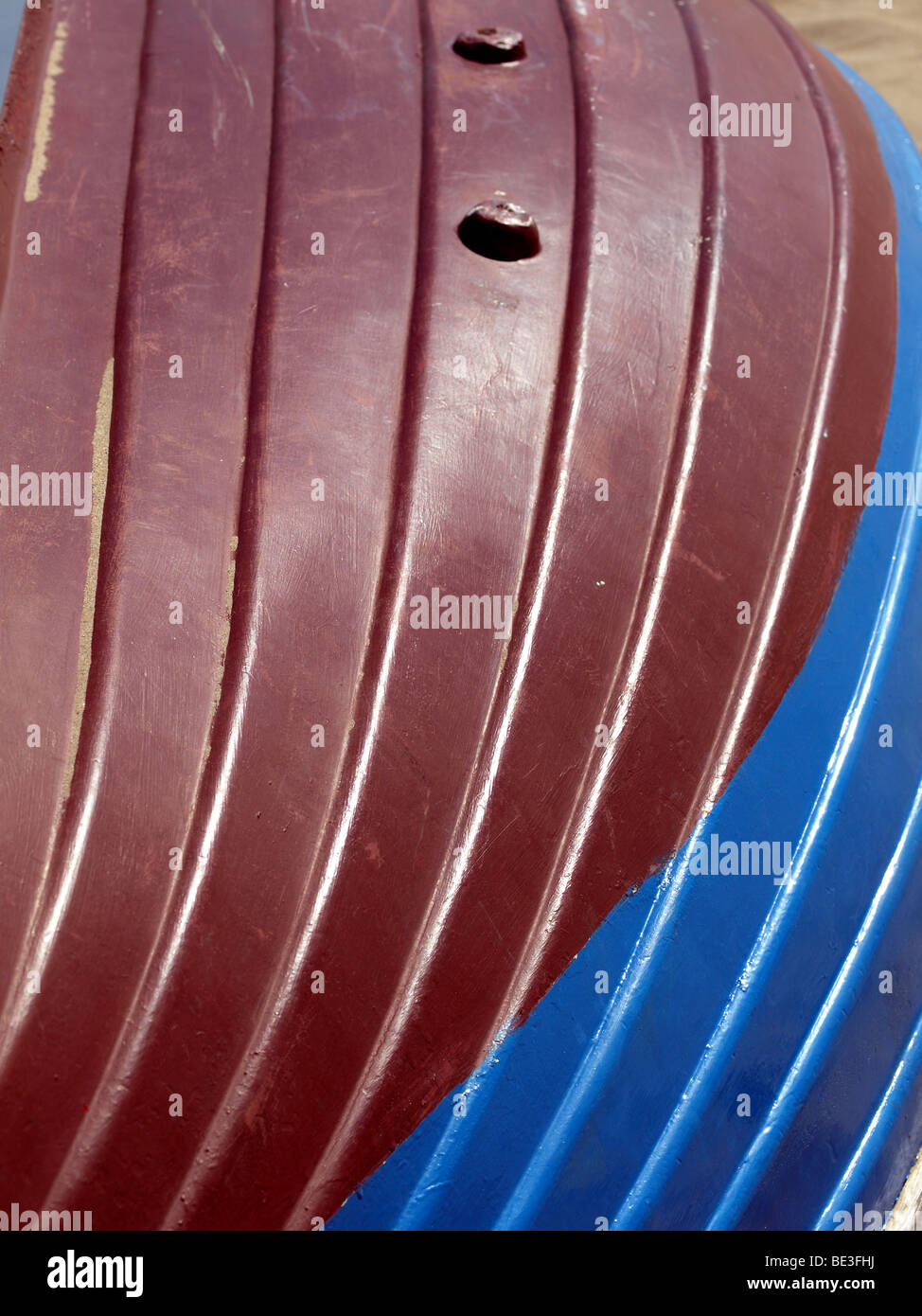 Symmetrical lines of the underside of a rowing boat Stock Photo - Alamy