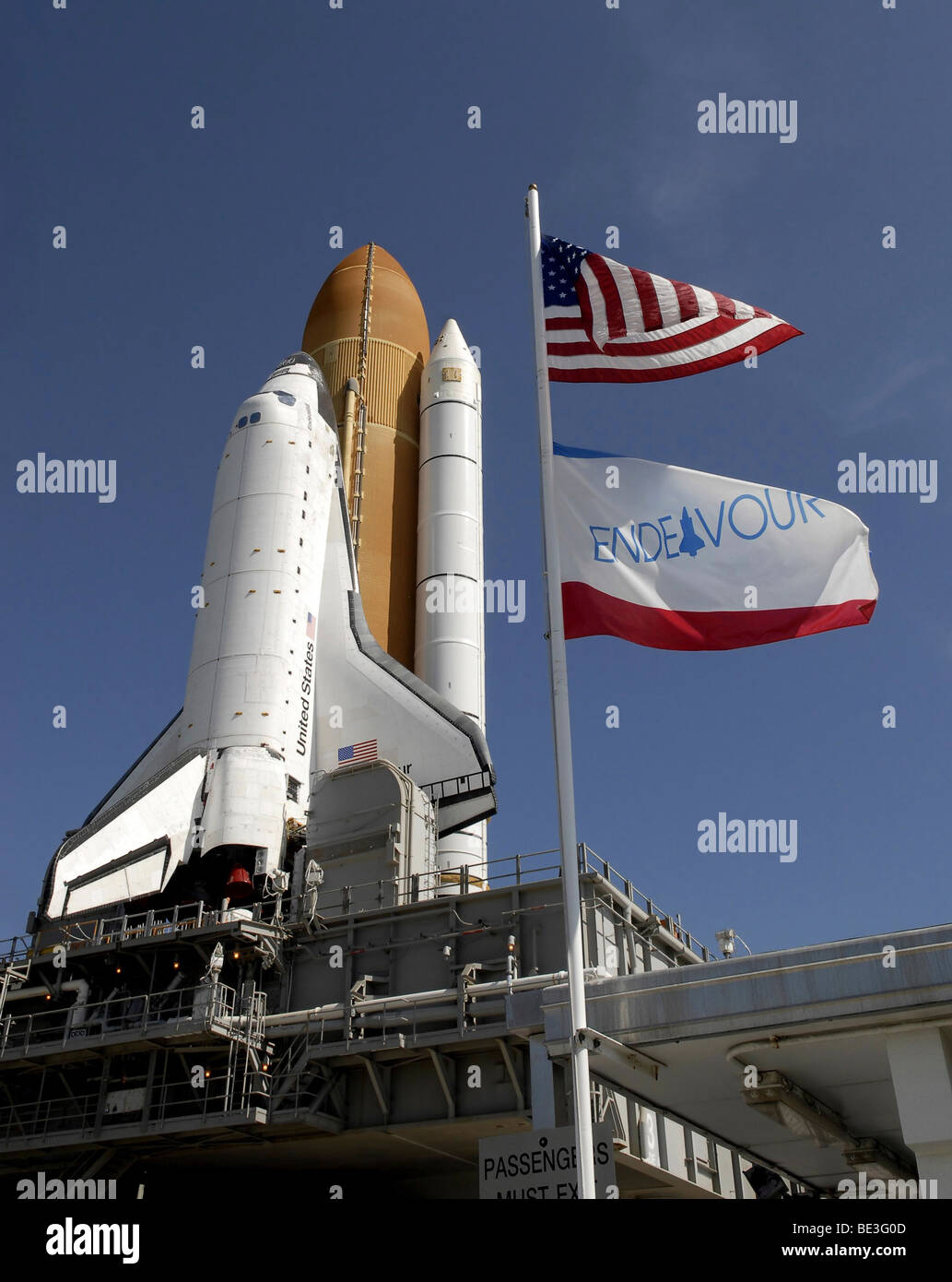 At NASA's Kennedy Space Center in Florida, flags swing in the breeze as ...