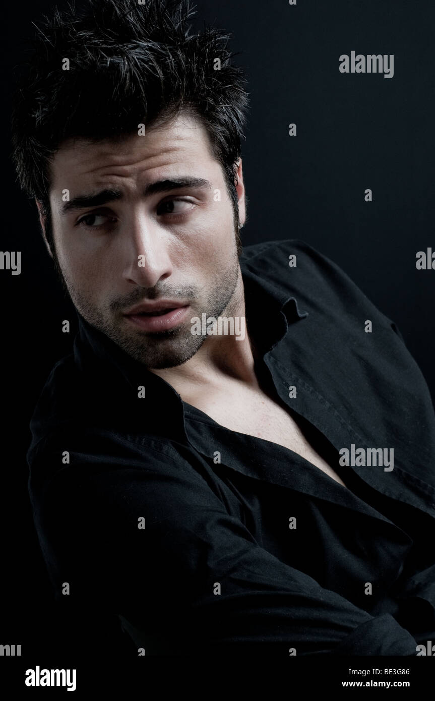 Handsome latin stylish man looking away. Fine art portrait Stock Photo ...