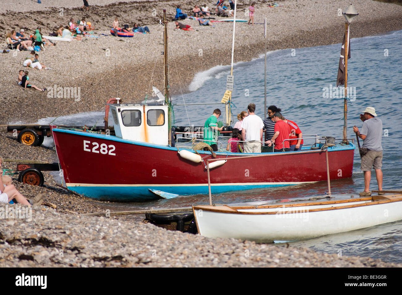 Beer Devon England UK A Beached Red fishing boat Stock Photo - Alamy