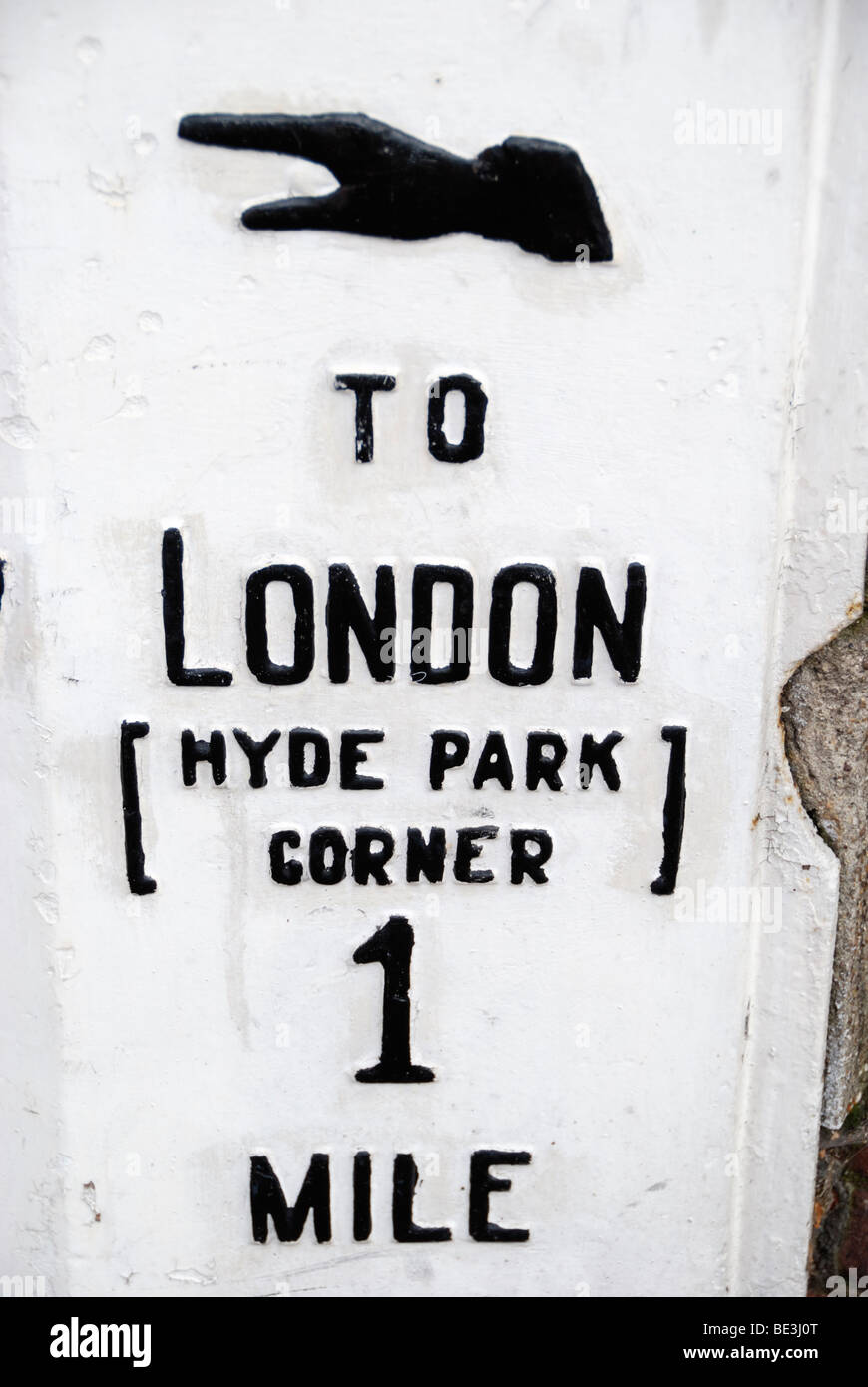 Mile post showing a distance of one mile to London Stock Photo - Alamy