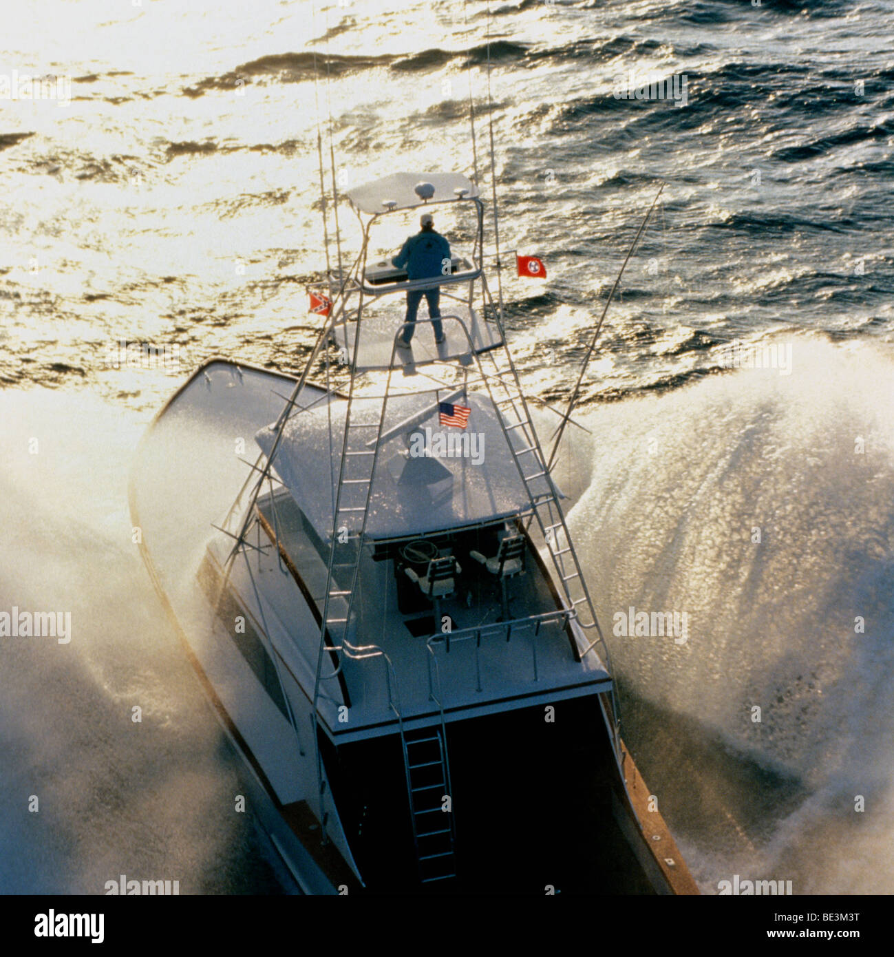Sport fishing boat breaking wave Stock Photo - Alamy