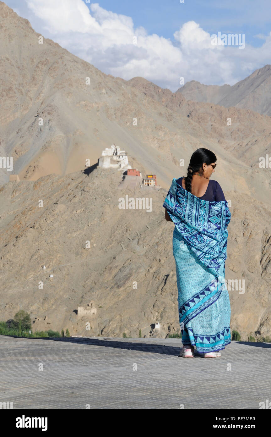 Indian woman as a tourist in the summer holidays above the oasis of Leh ...