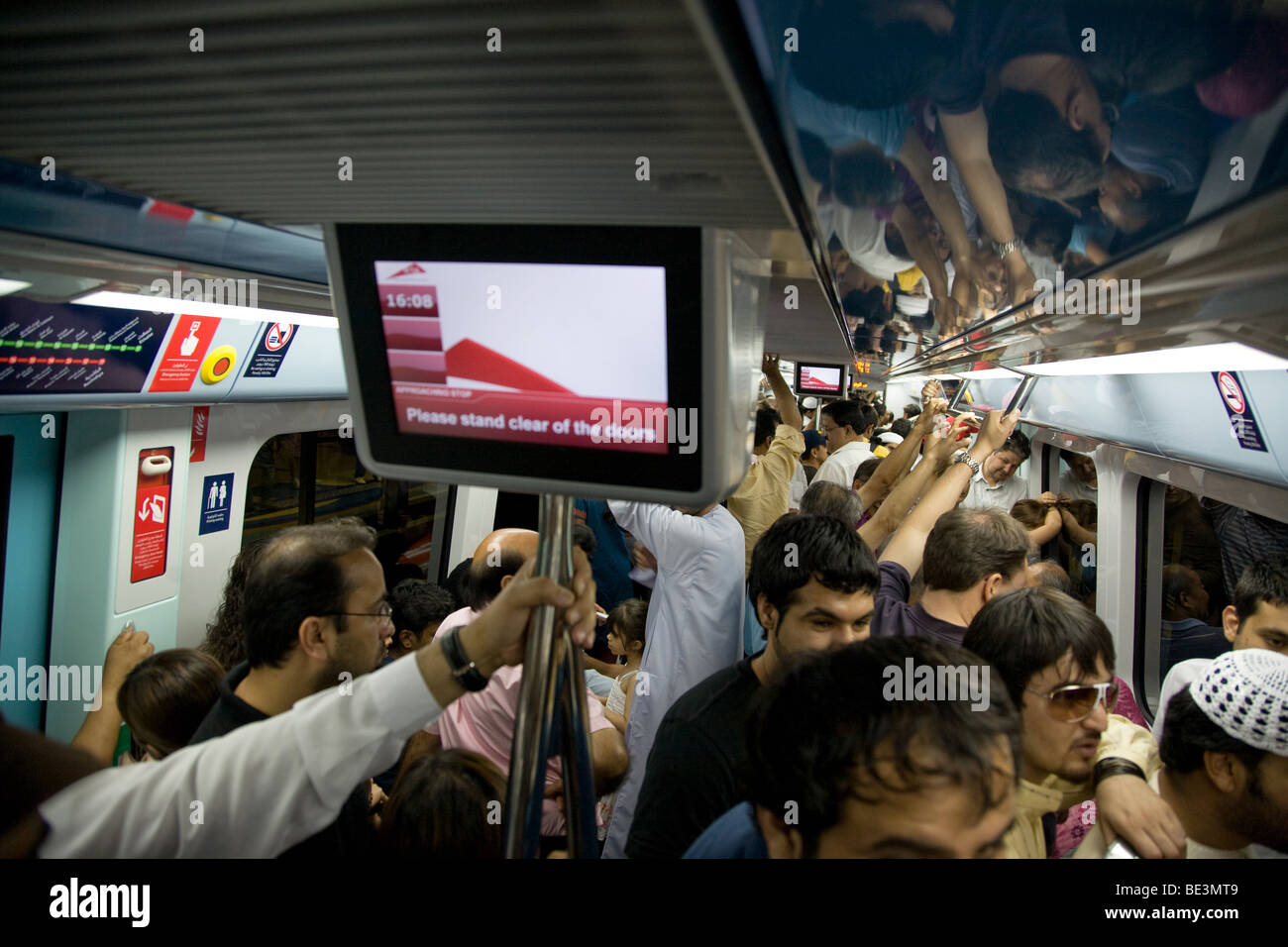rush hour commuters dubai metro train overcrowding Stock Photo - Alamy